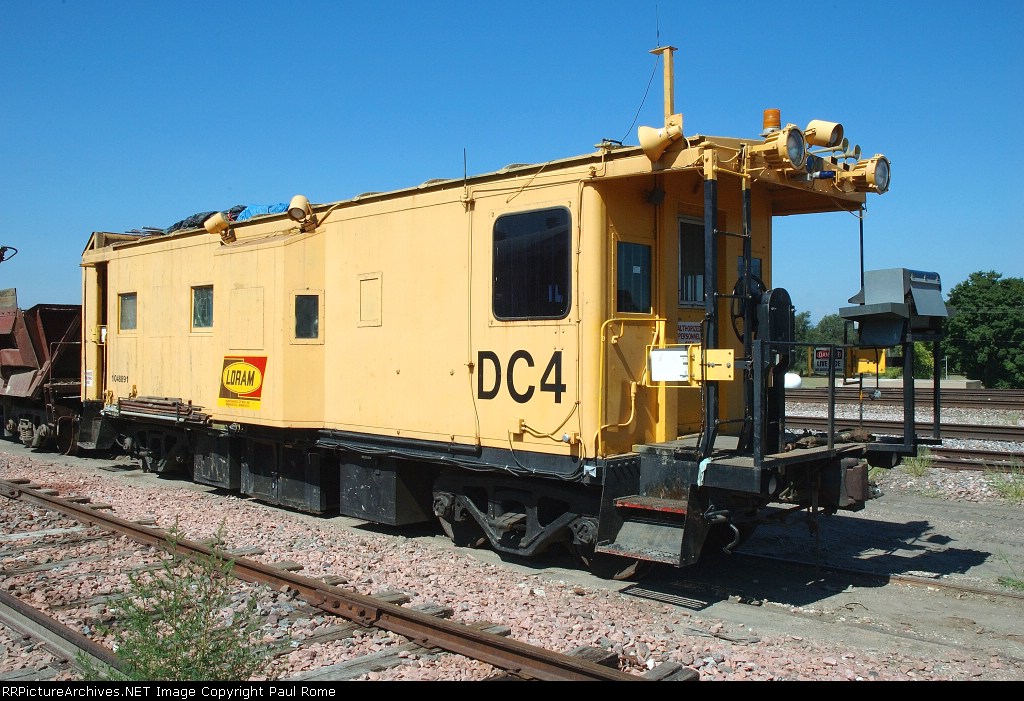 LMIX DC4, Loram 1048891, Bay Window Caboose, working on a Loram track maintenance train